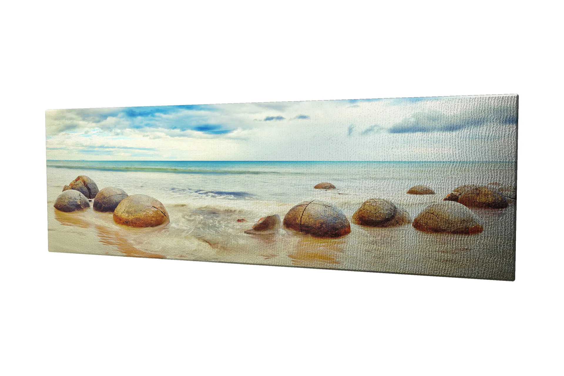 Lærredstryk 80x30 cm - Runde sten på en strand med hav og himmel i ...